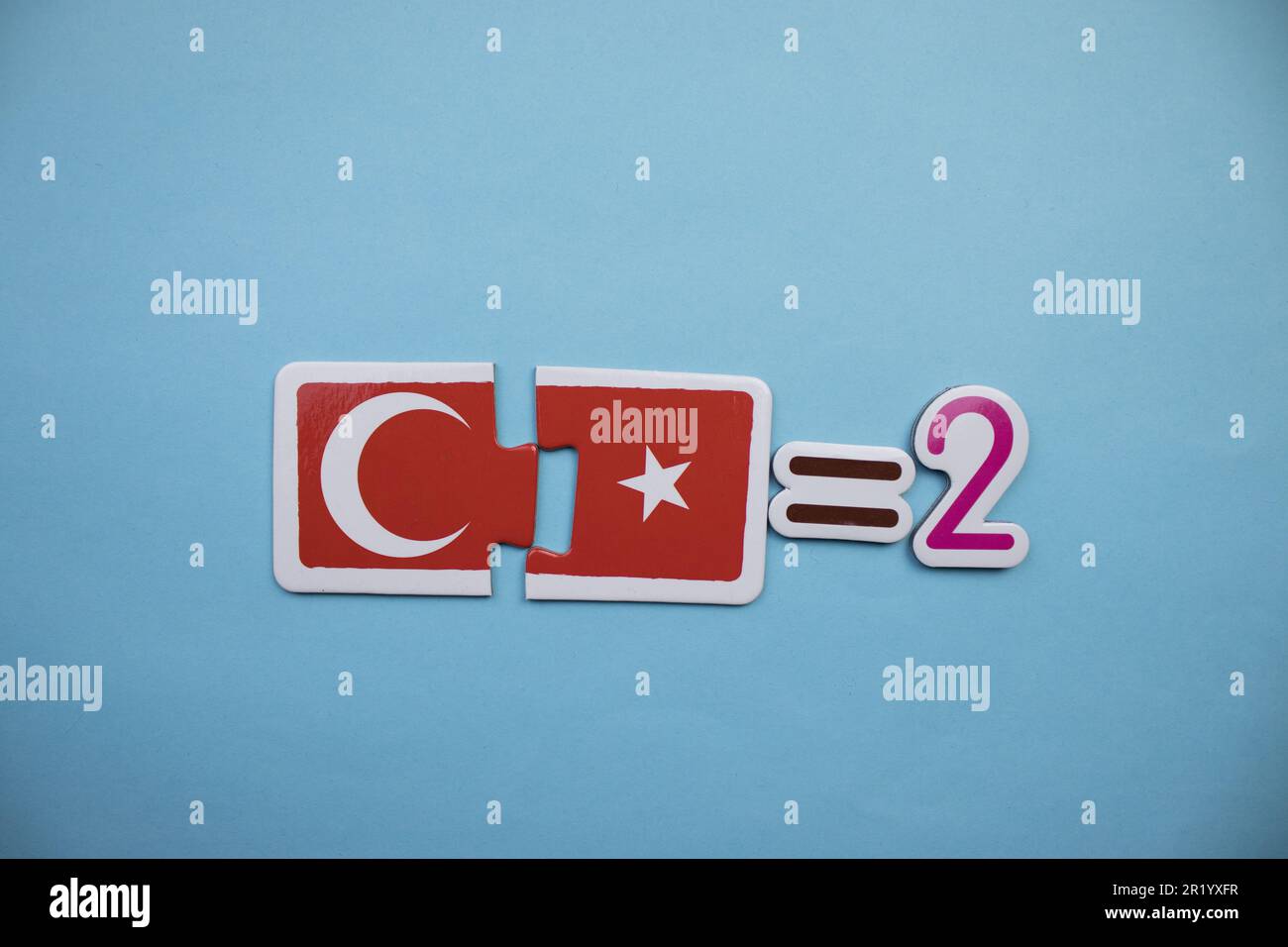 Mathematical operation with educational puzzles placed on a blue ...