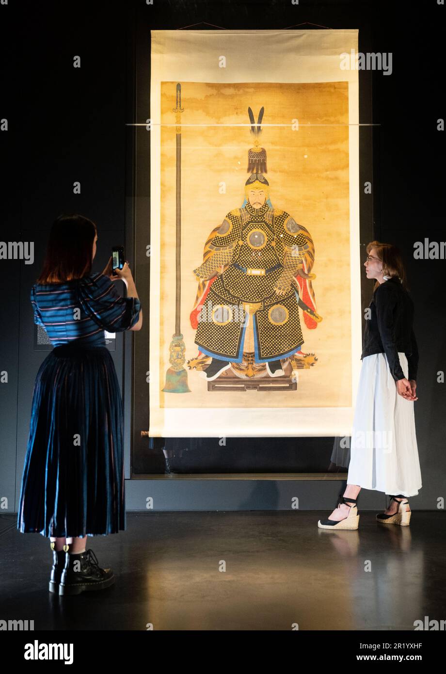 British Museum workers look at an Ancestor Portrait of a bannerman ...