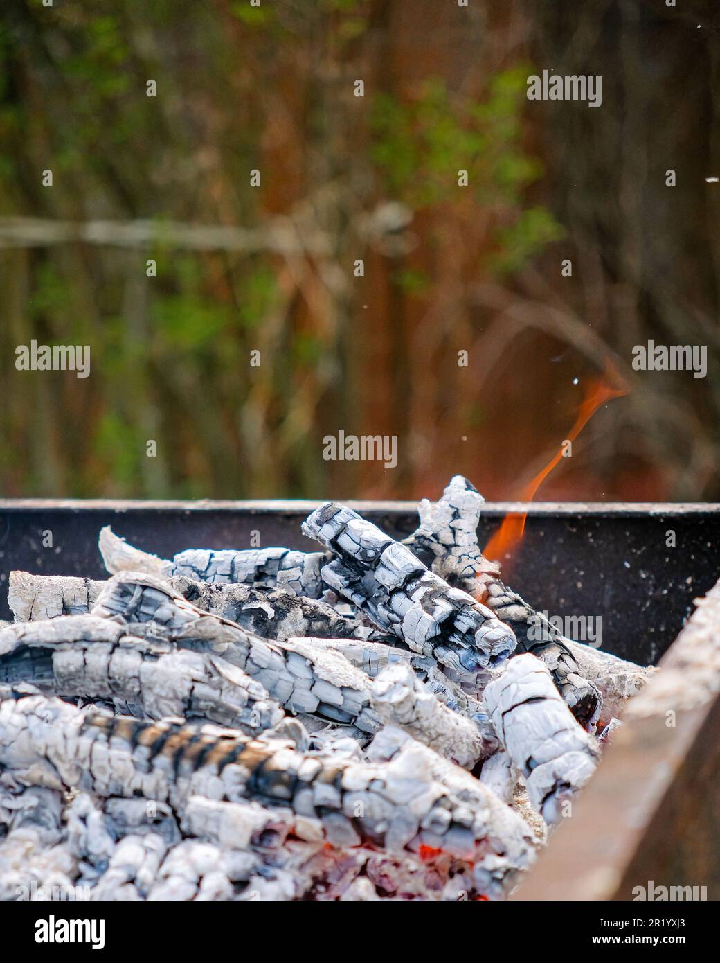 Hot coals and ashes in a brazier. Selective focus Stock Photo - Alamy