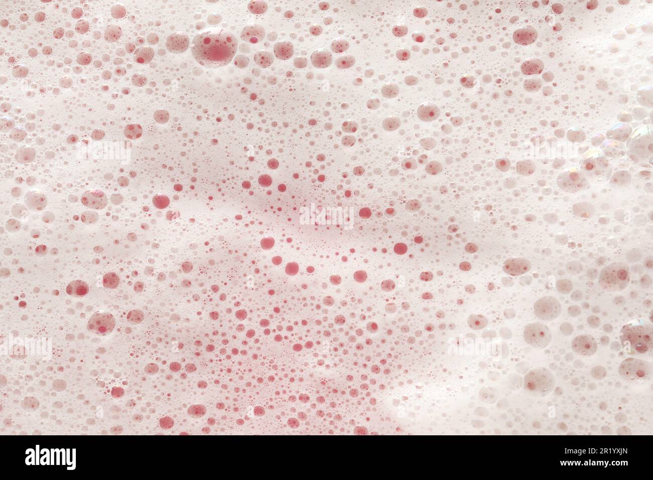 White washing foam on pale pink background, top view Stock Photo - Alamy