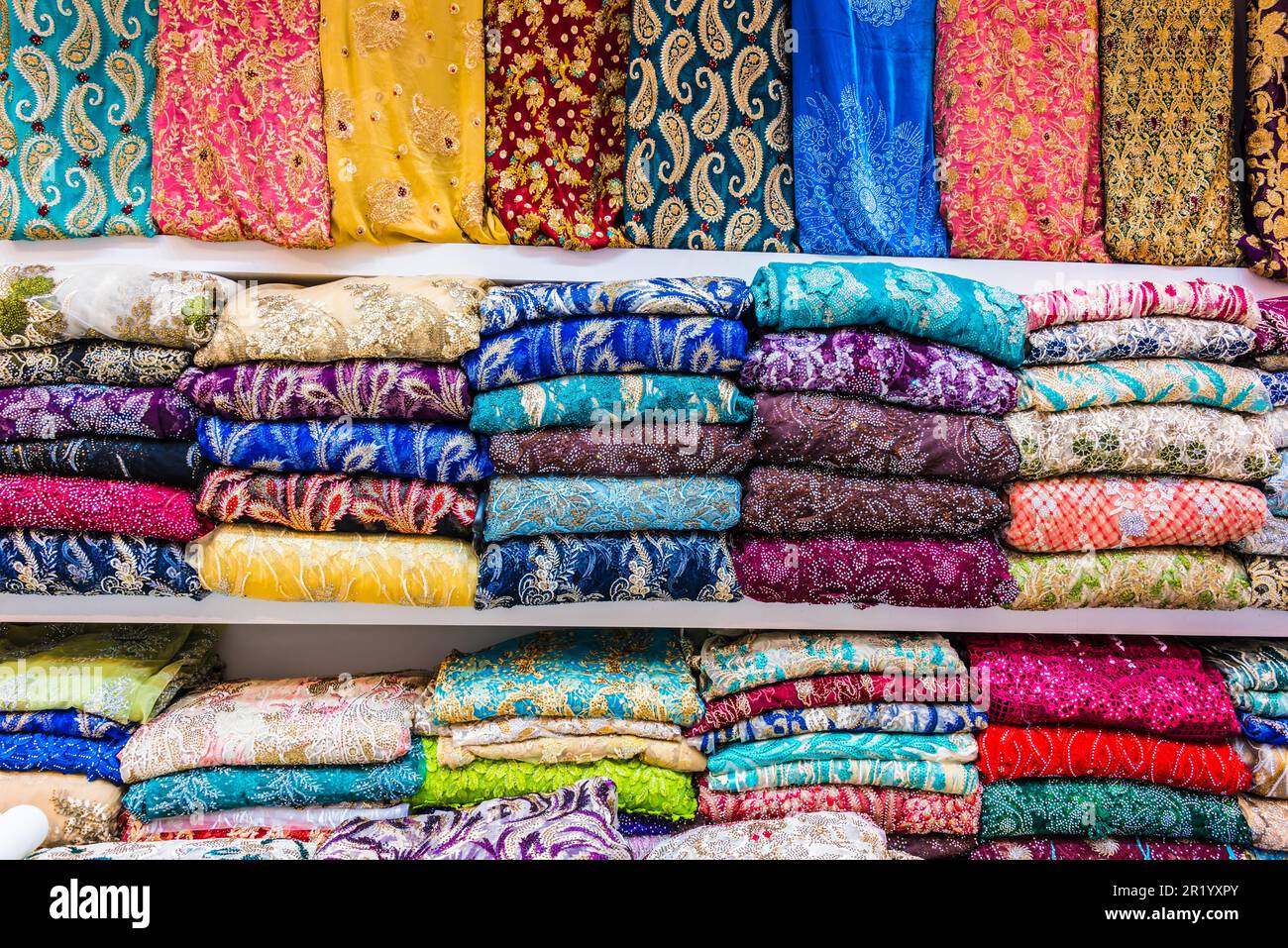 Traditional oriental cloth sold in a store in old town Dubai, United ...