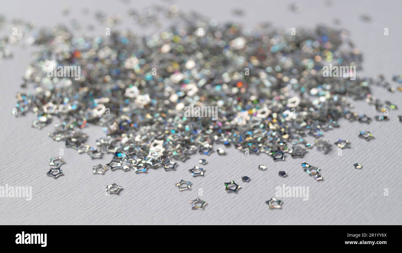 Pile of silver star shaped sequins on white background, closeup Stock ...