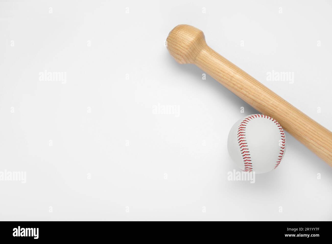 Wooden baseball bat and ball on white background, top view with space ...