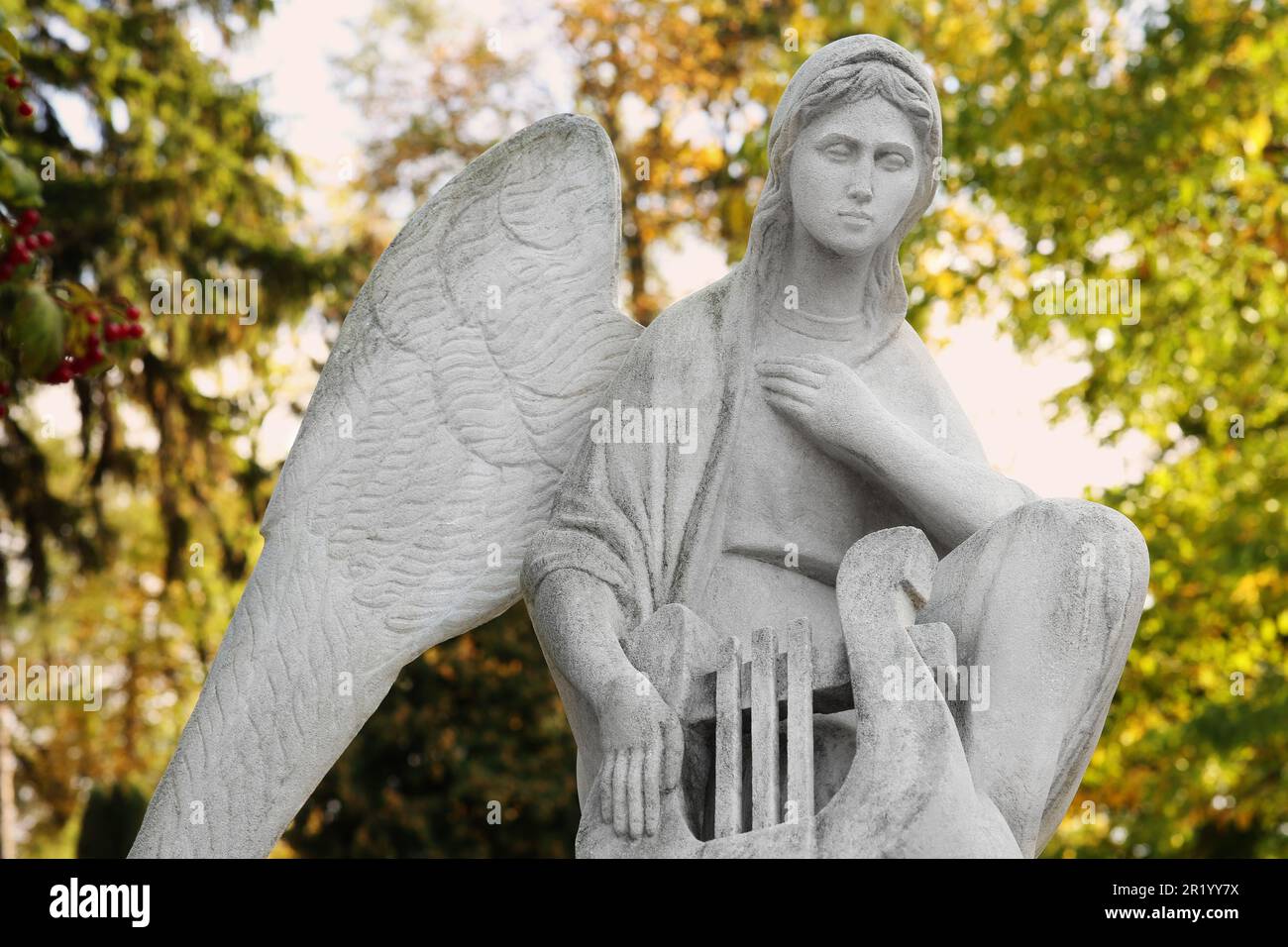 Beautiful statue of angel at cemetery. Funeral ceremony Stock Photo - Alamy