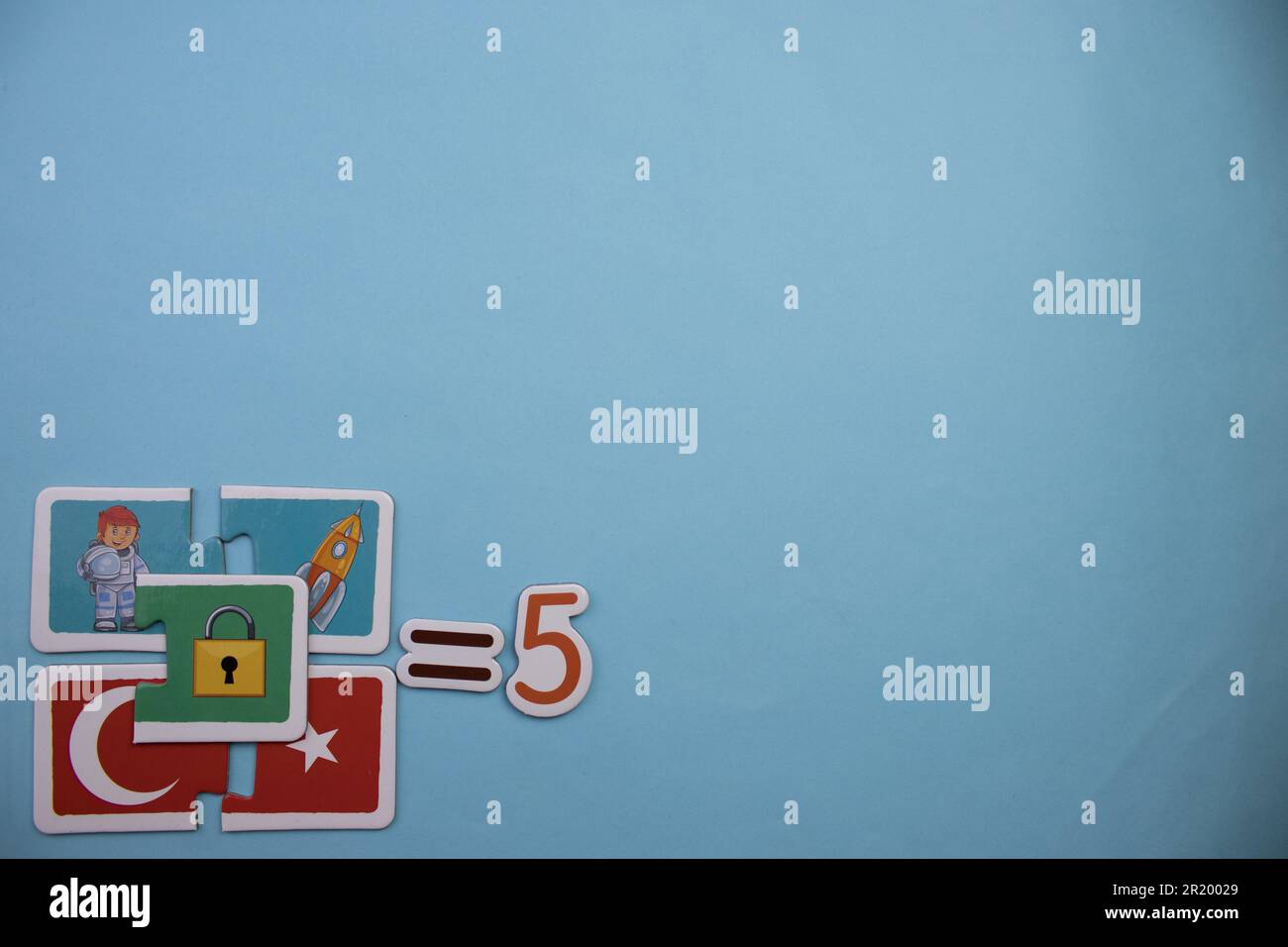 Mathematical operation with educational puzzles placed on the edge of ...