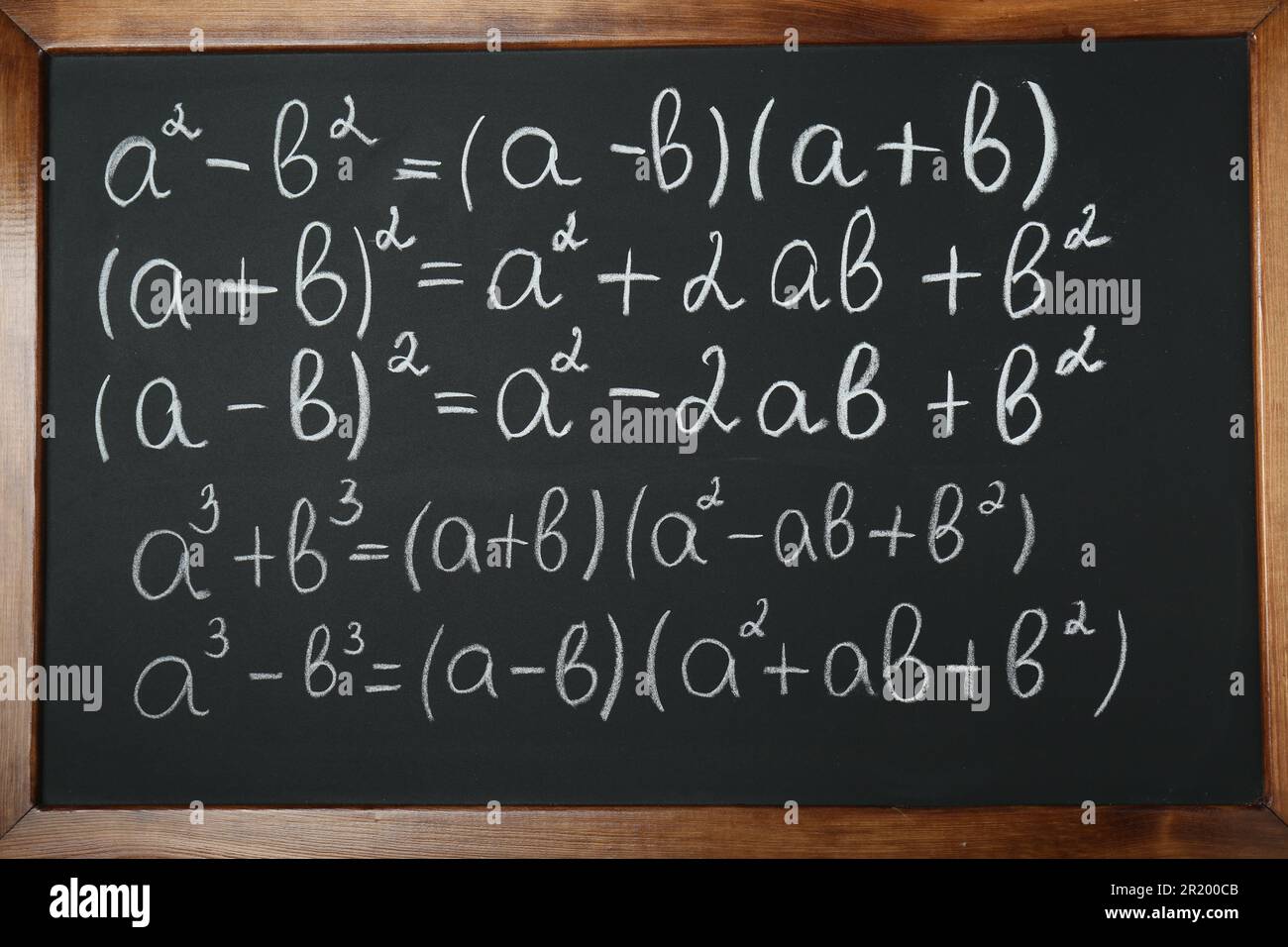 Many different math formulas written on chalkboard, closeup Stock Photo ...