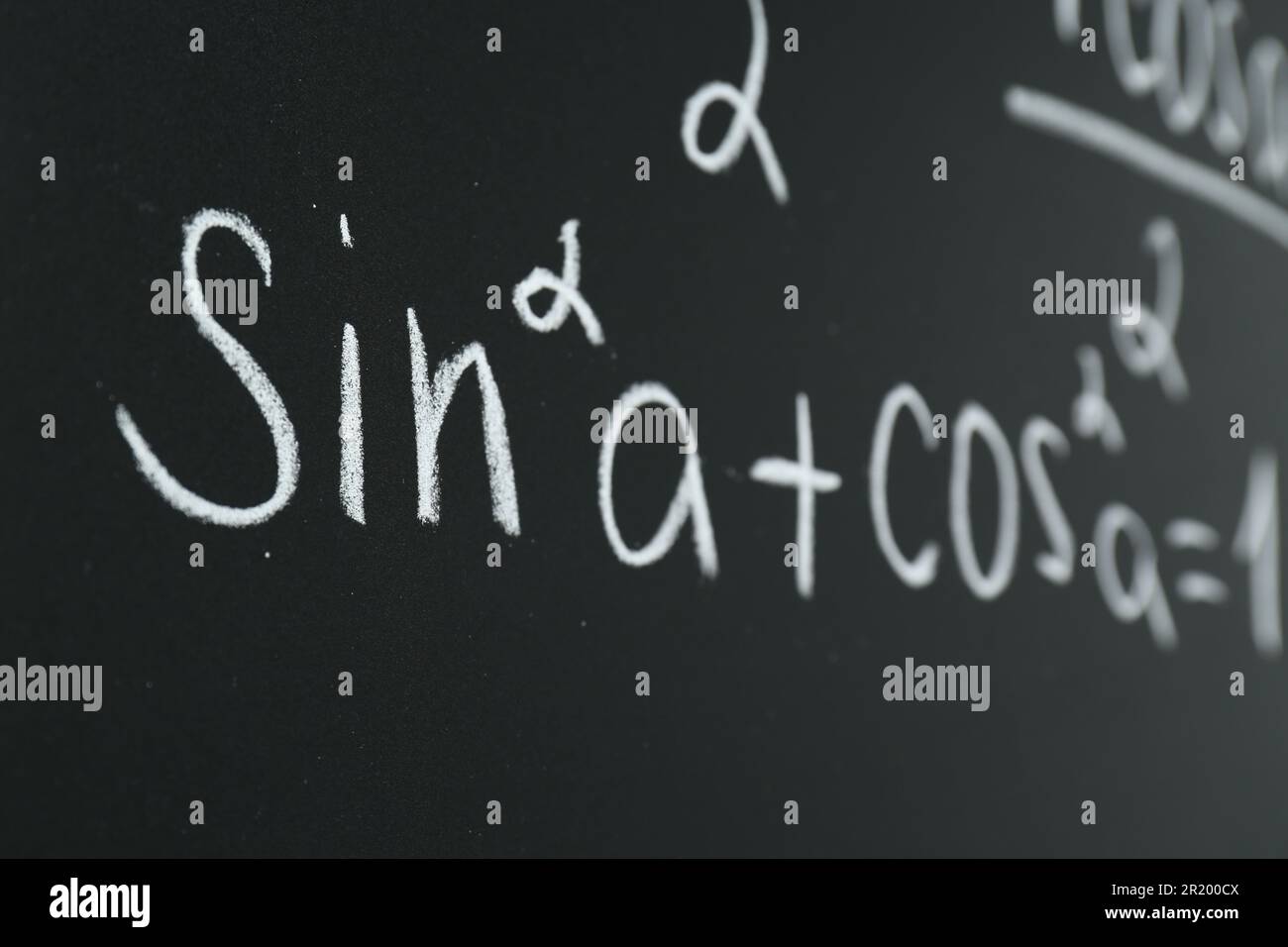 Math formula written on chalkboard, closeup view Stock Photo - Alamy