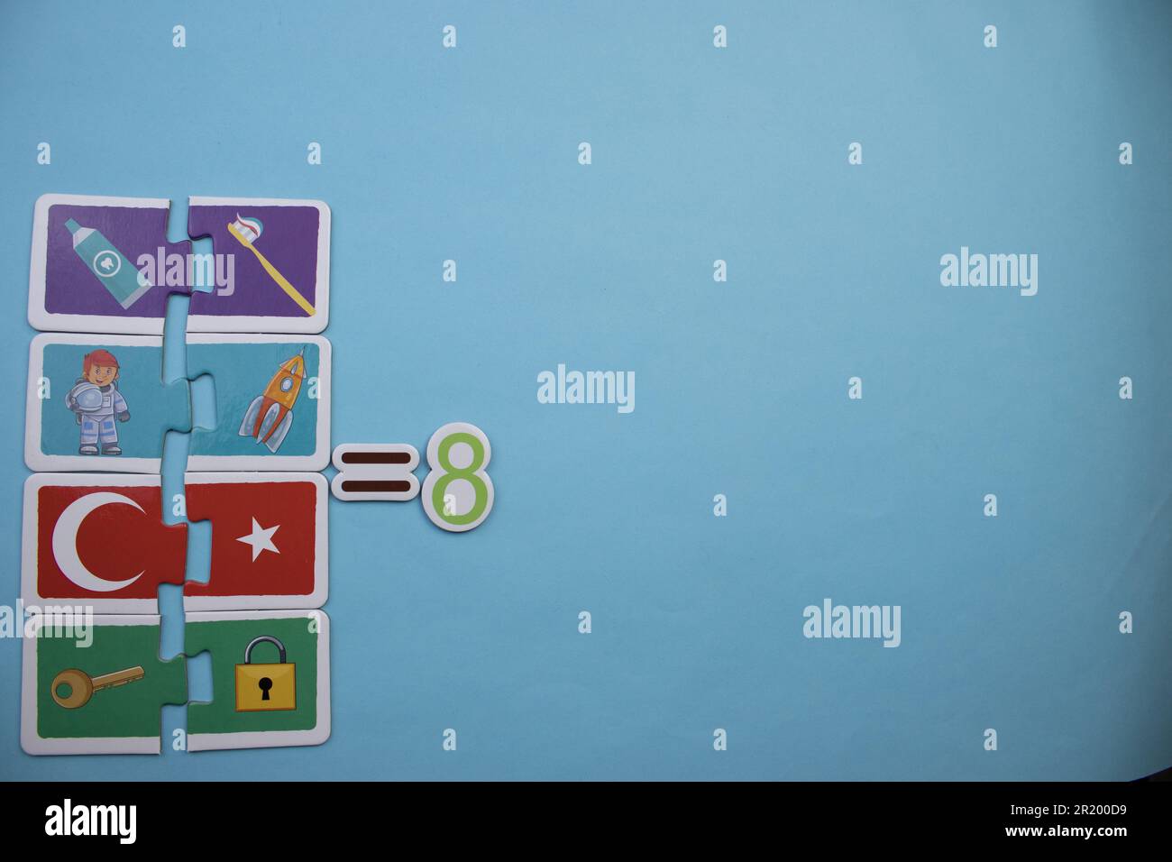 Mathematical operation with educational puzzles placed on a blue ...