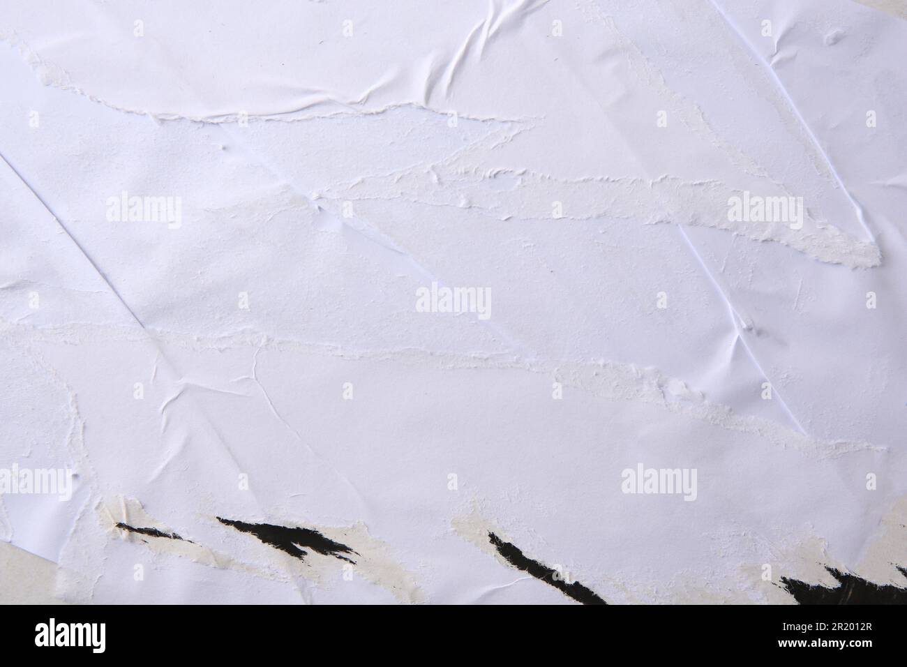 Texture of ripped paper poster, closeup view Stock Photo - Alamy