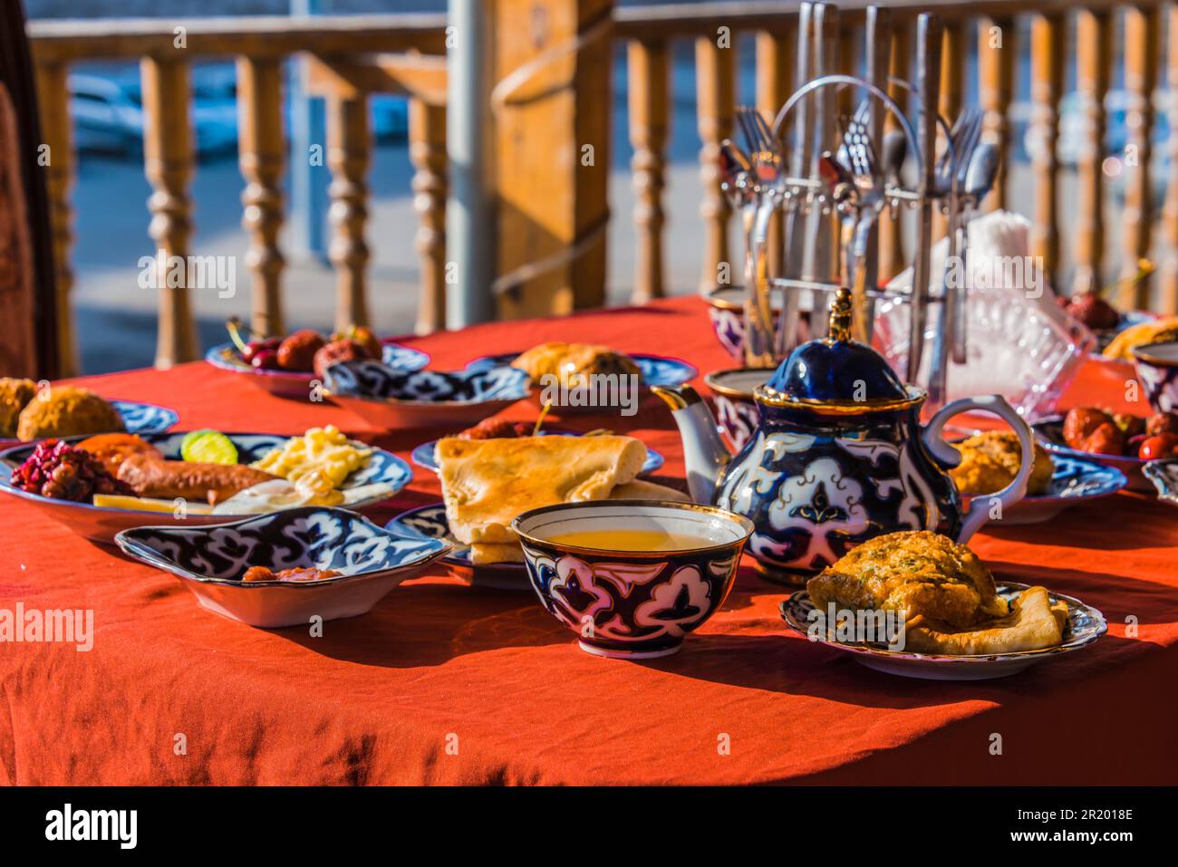 Traditional Uzbek breakfast served on the terrace Stock Photo - Alamy