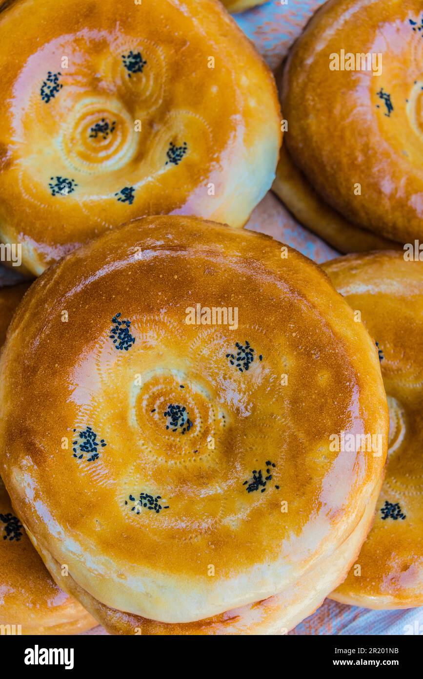 Tandir non or lepeshka, tarditional uzbek bread sold at Siab Bazaar in ...