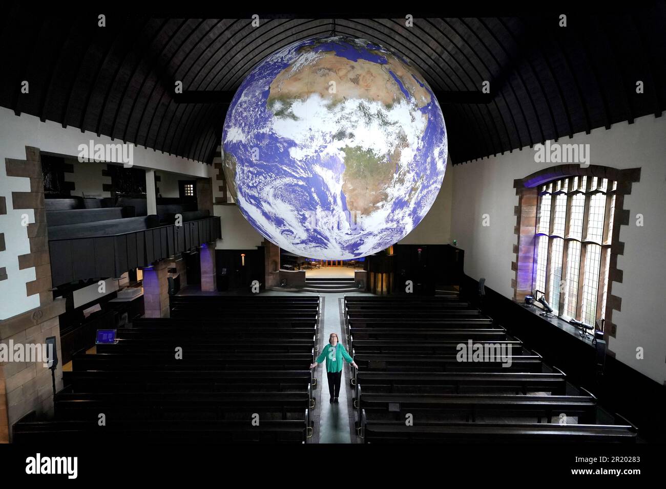 Volunteer Lillian Kerr views Gaia, Luke Jerram's seven-metre-wide ...