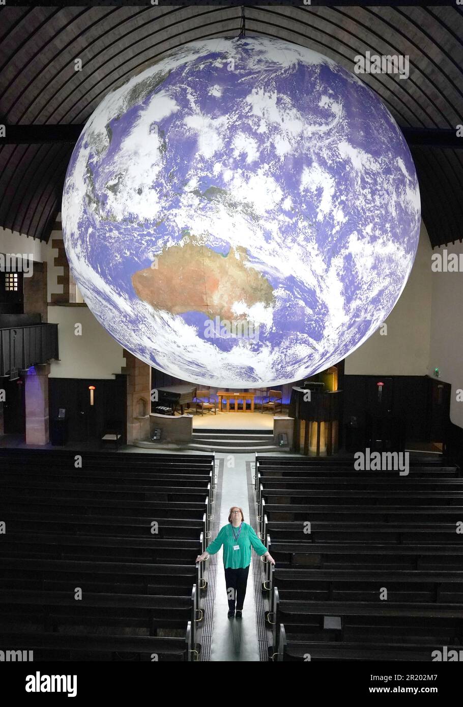Volunteer Lillian Kerr views Gaia, Luke Jerram's seven-metre-wide ...