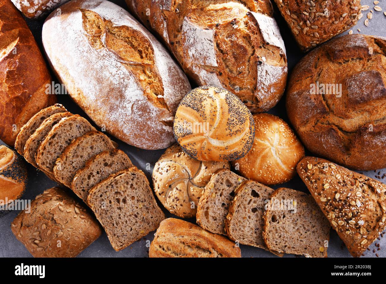 Assorted bakery products including loafs of bread and rolls Stock Photo ...