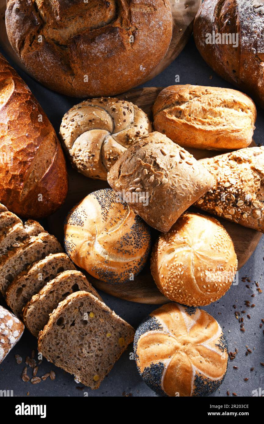 Assorted bakery products including loafs of bread and rolls Stock Photo ...