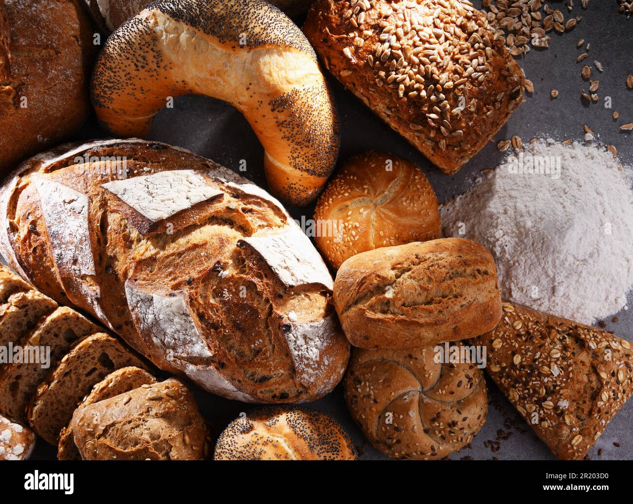 Assorted bakery products including loafs of bread and rolls Stock Photo ...