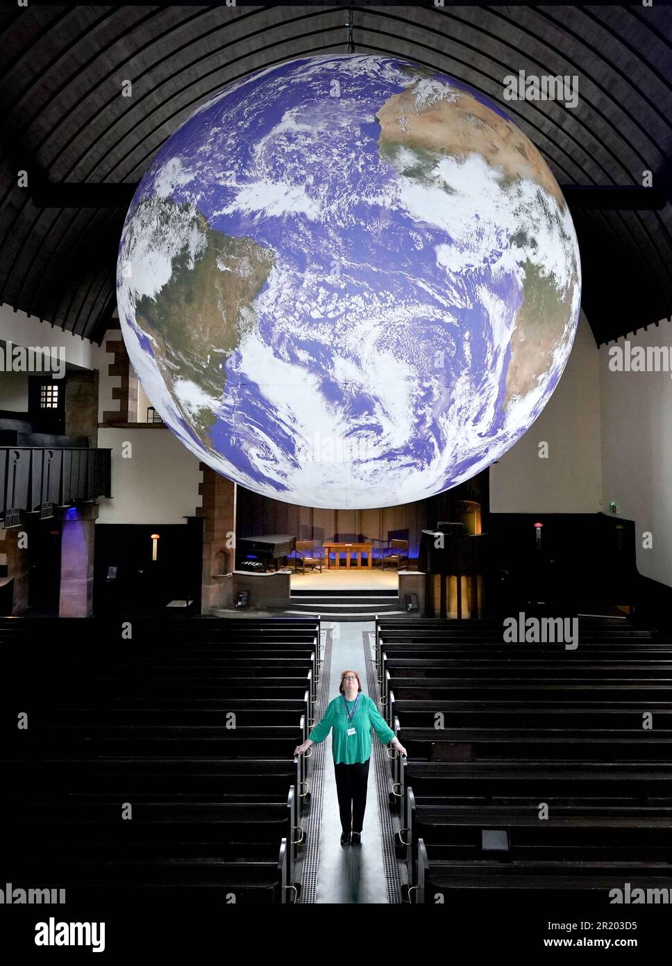 Volunteer Lillian Kerr views Gaia, Luke Jerram's seven-metre-wide ...