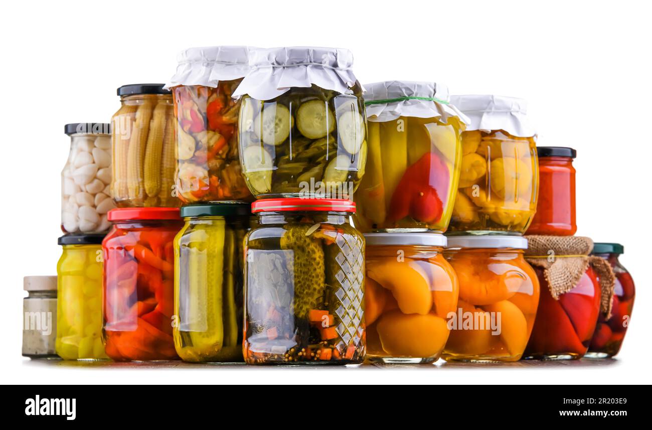 Jars with variety of marinated vegetables and fruits. Preserved food ...