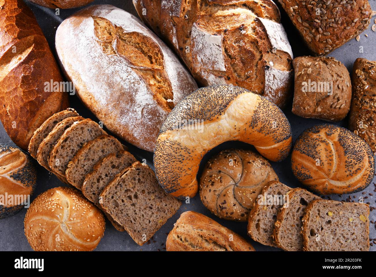 Assorted bakery products including loafs of bread and rolls Stock Photo ...