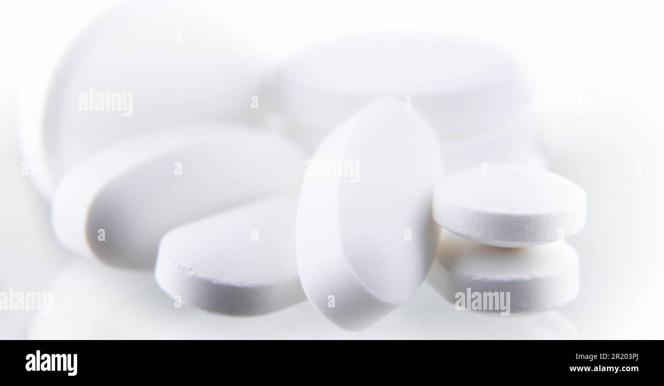 Composition with pharmaceutical drug pills over white background Stock ...