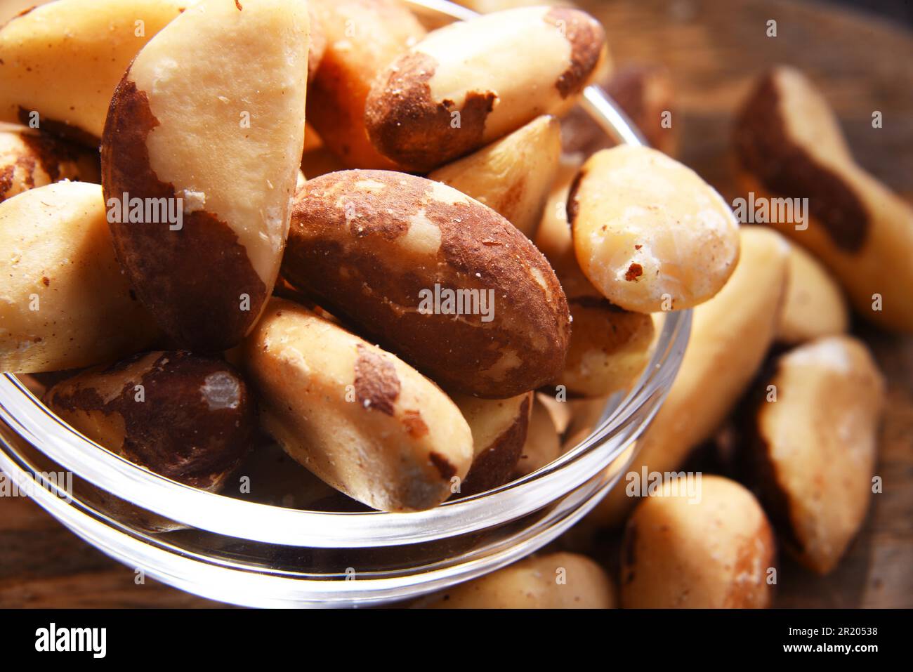 Composition with a bowl of shelled brazil nuts. Delicacies Stock Photo ...