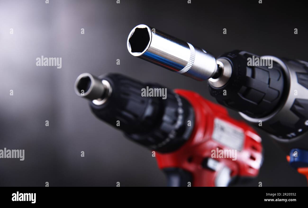 A screw gun and a pistol-grip cordless drill Stock Photo - Alamy