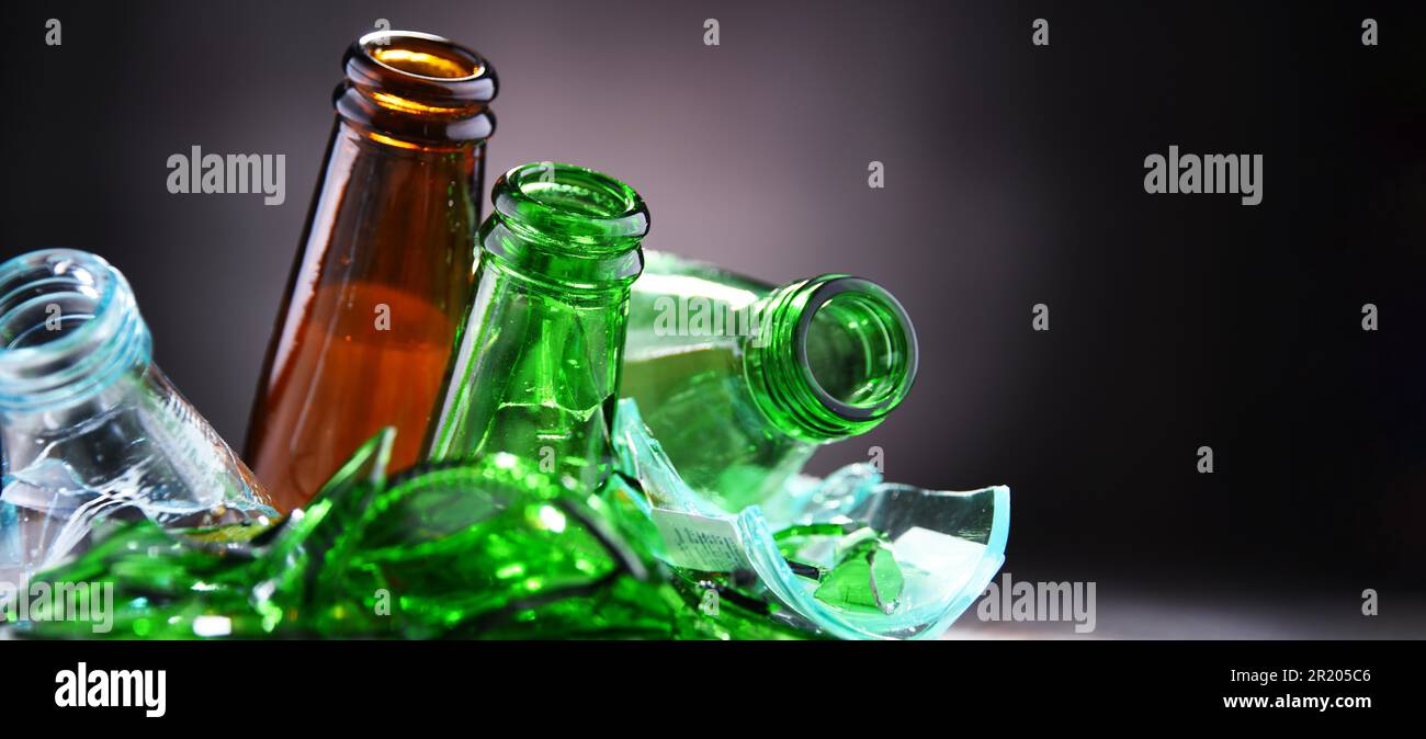 Broken glass bottles and pieces of glass. Recycling Stock Photo - Alamy
