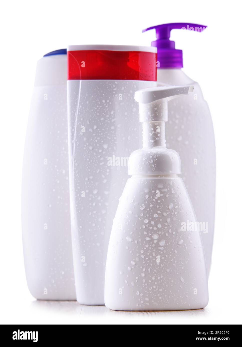 Plastic contaiers of shampoos and shower gels isolated on white ...