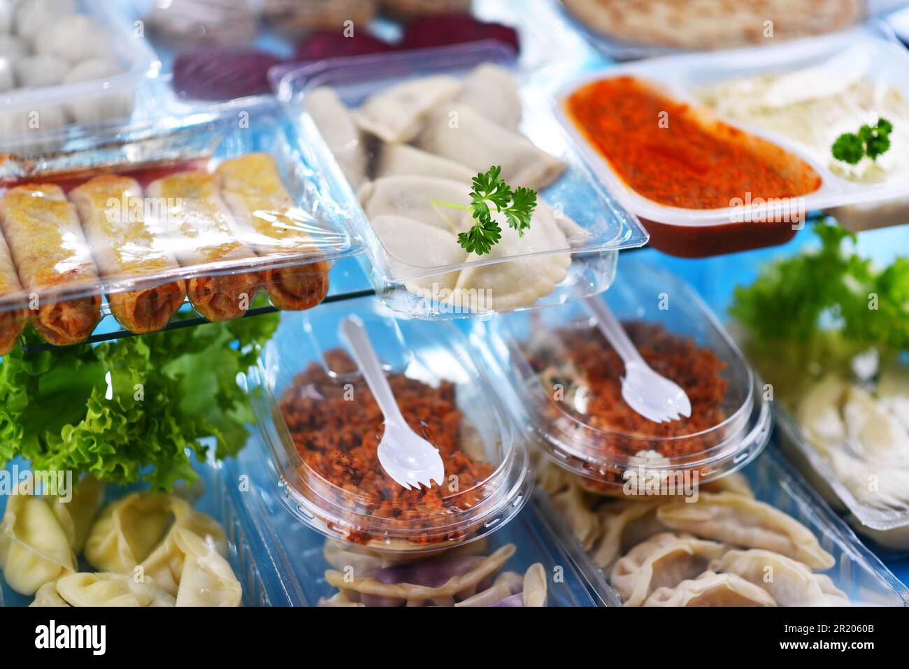 A variety of prepackaged food products in plastic boxes Stock Photo - Alamy