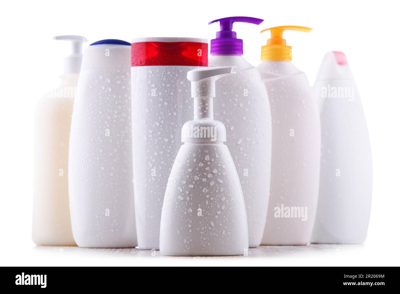 Plastic contaiers of shampoos and shower gels isolated on white ...