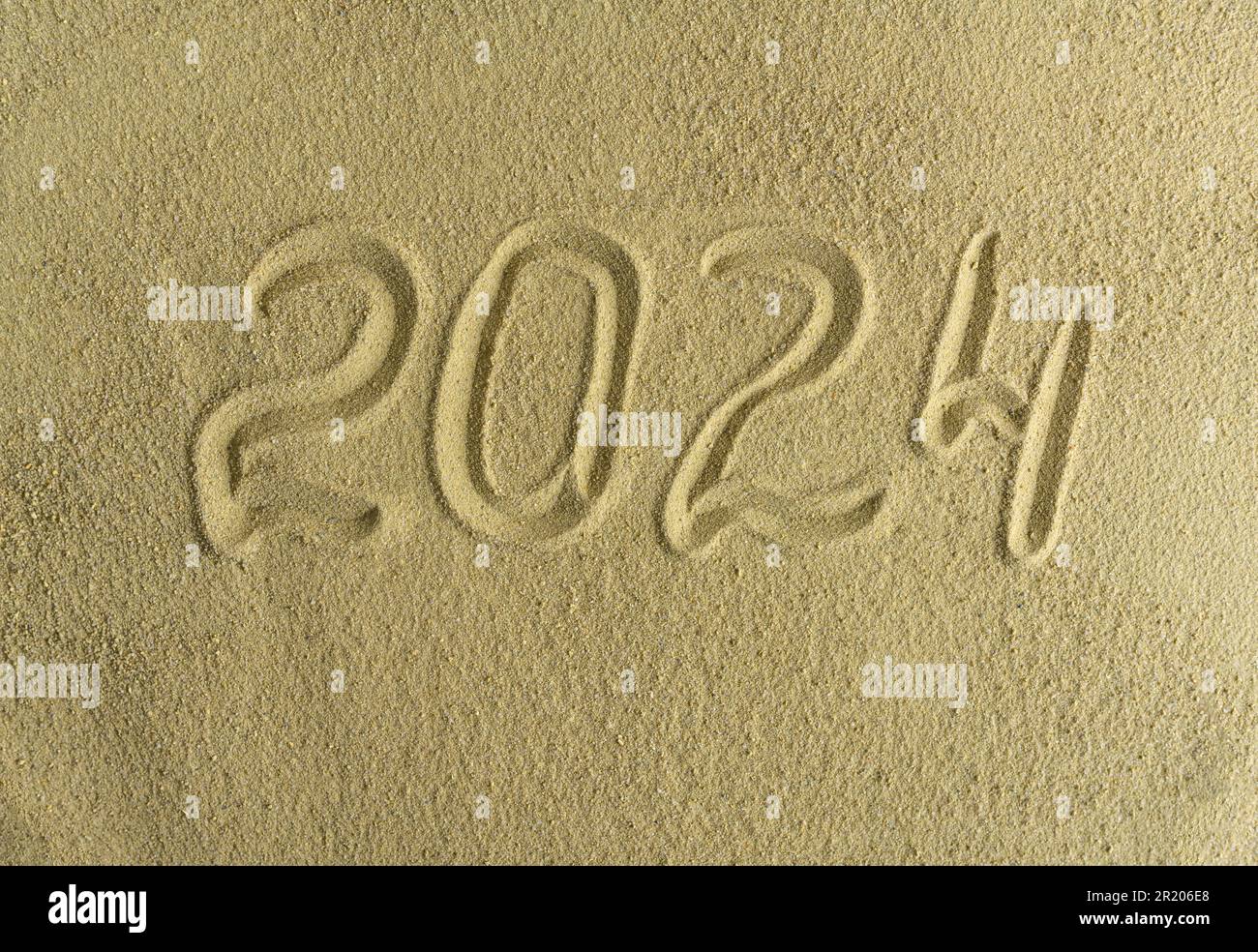 Numbers 2024 on the sea sand Stock Photo - Alamy