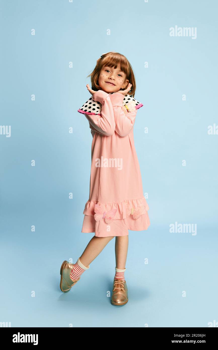 Full-length portrait of beautiful, pretty, cute little girl in tender ...