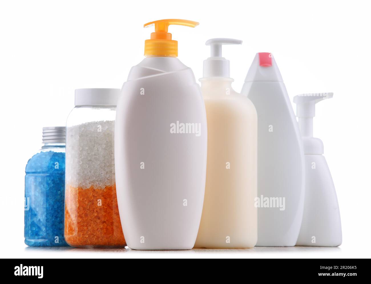 Plastic contaiers of shampoos and shower gels isolated on white ...