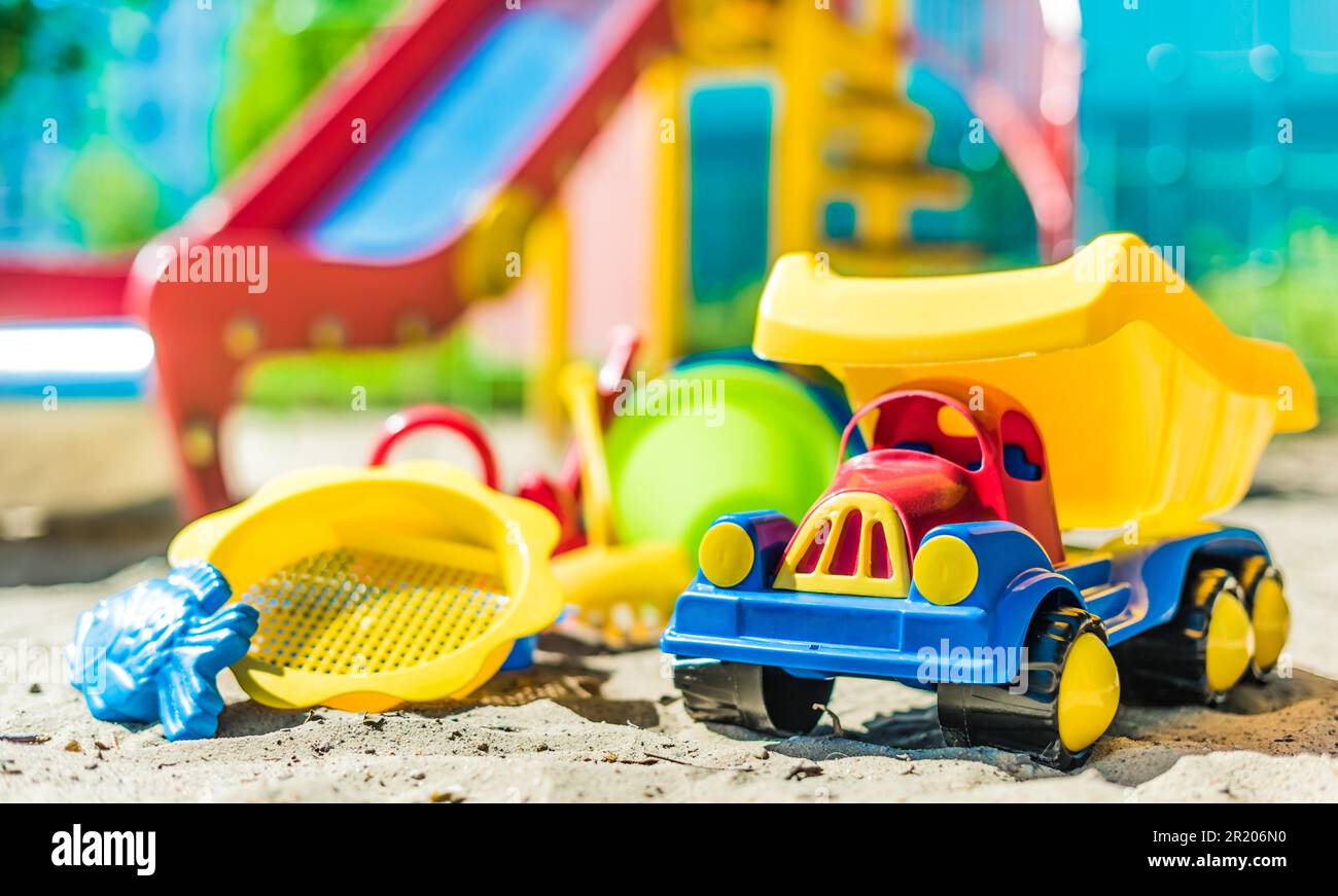 Colorful plastic children toys on the playground Stock Photo - Alamy