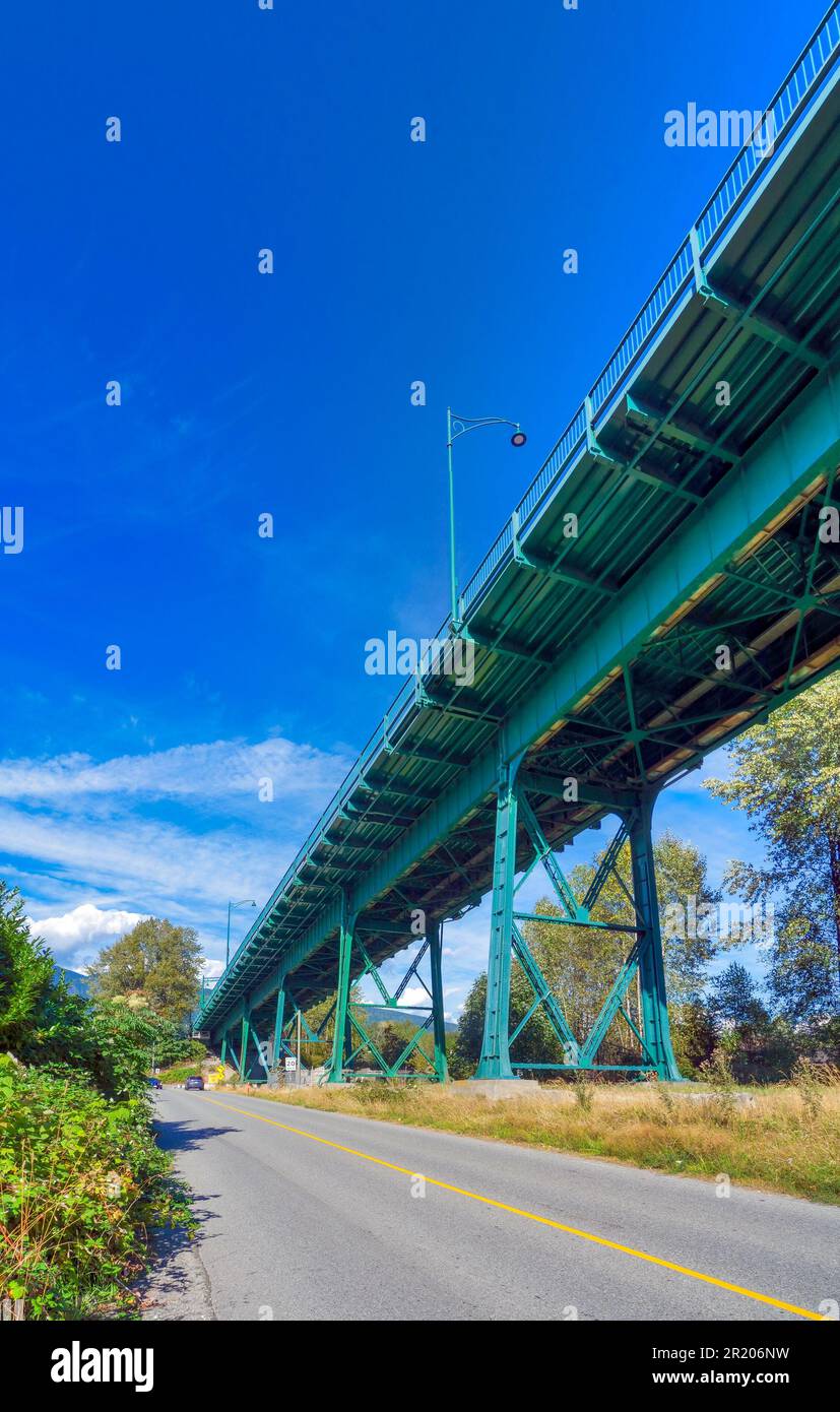 Lion Gates bridge over the asphalt road in West Vancouver Stock Photo ...