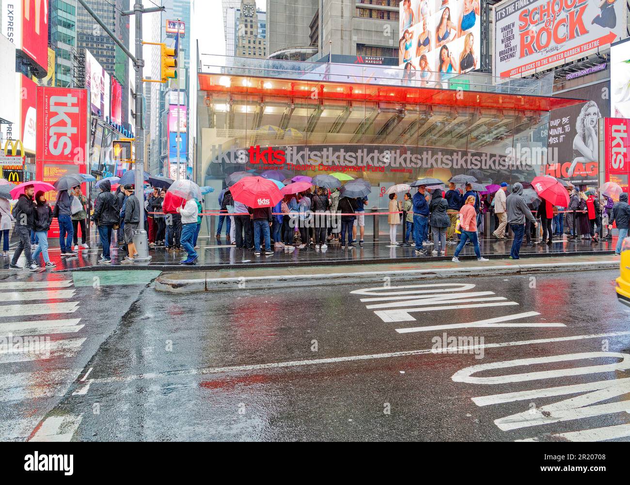 The umbrellas are out under a light September rain at the tkts booth in ...