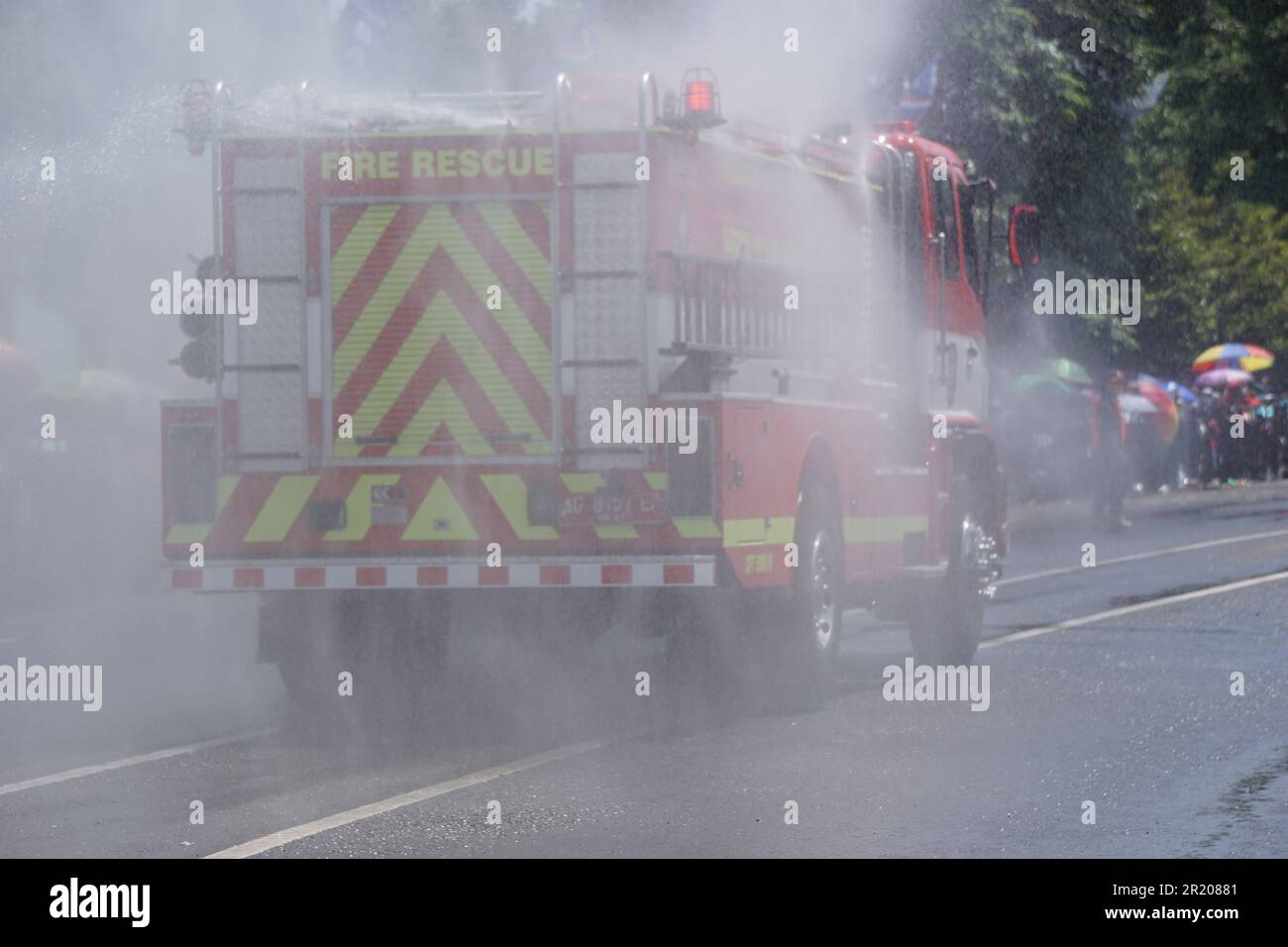 Red fire truck on the road Stock Photo - Alamy