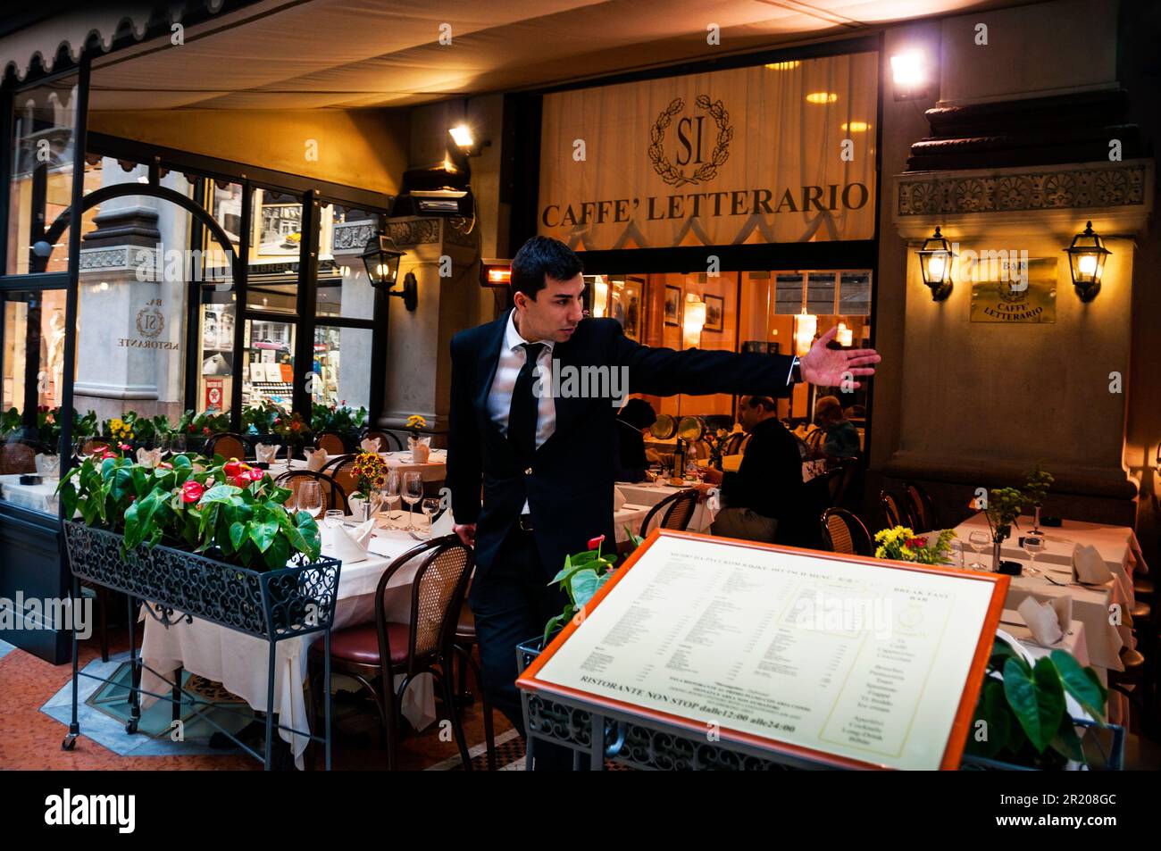 Italian waiter at the Caffè Letterario in the Galleria in Milan, Italy ...