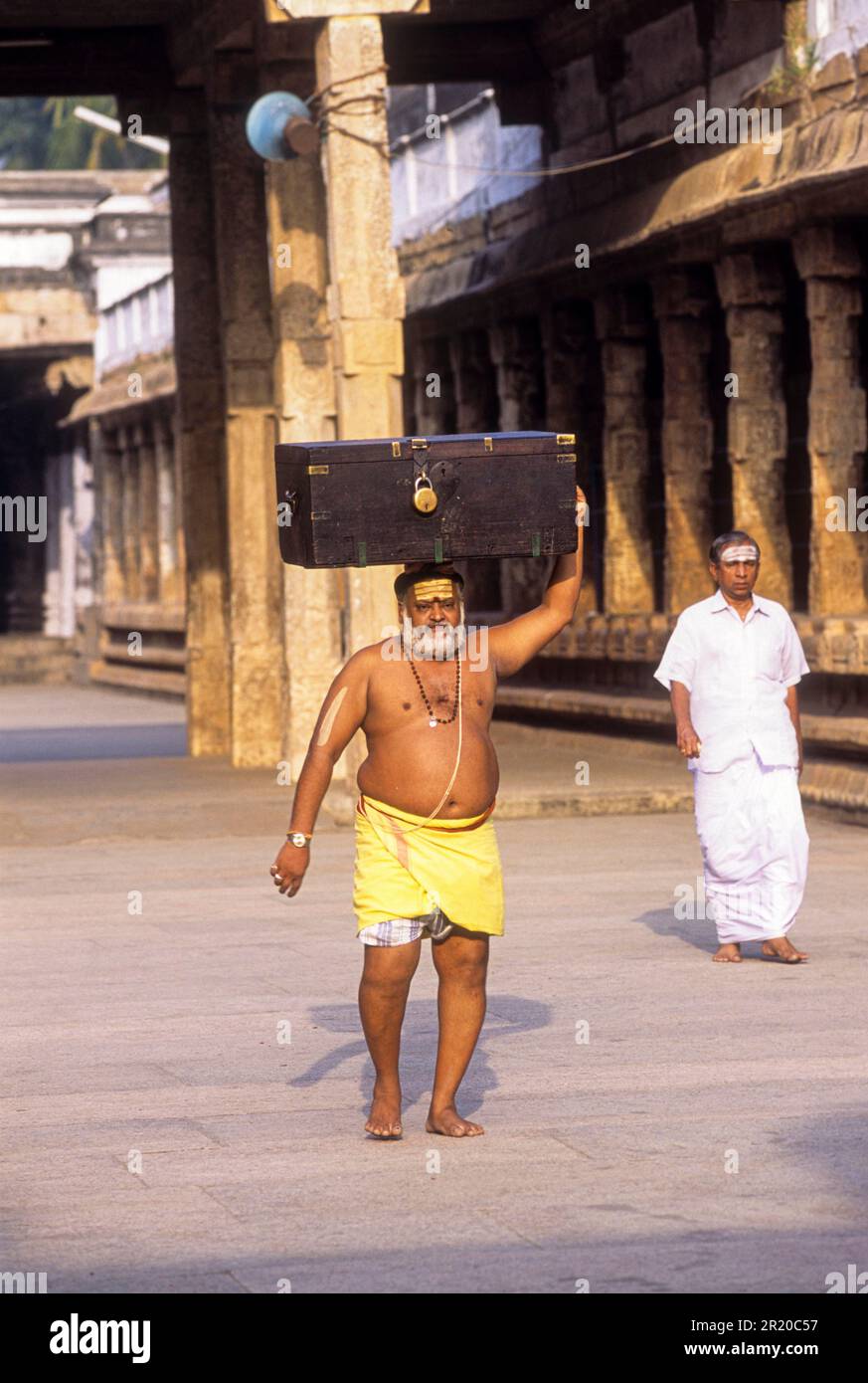 Priest carrying Temple Jewels sacred ornaments Thiruvabharanam on his ...