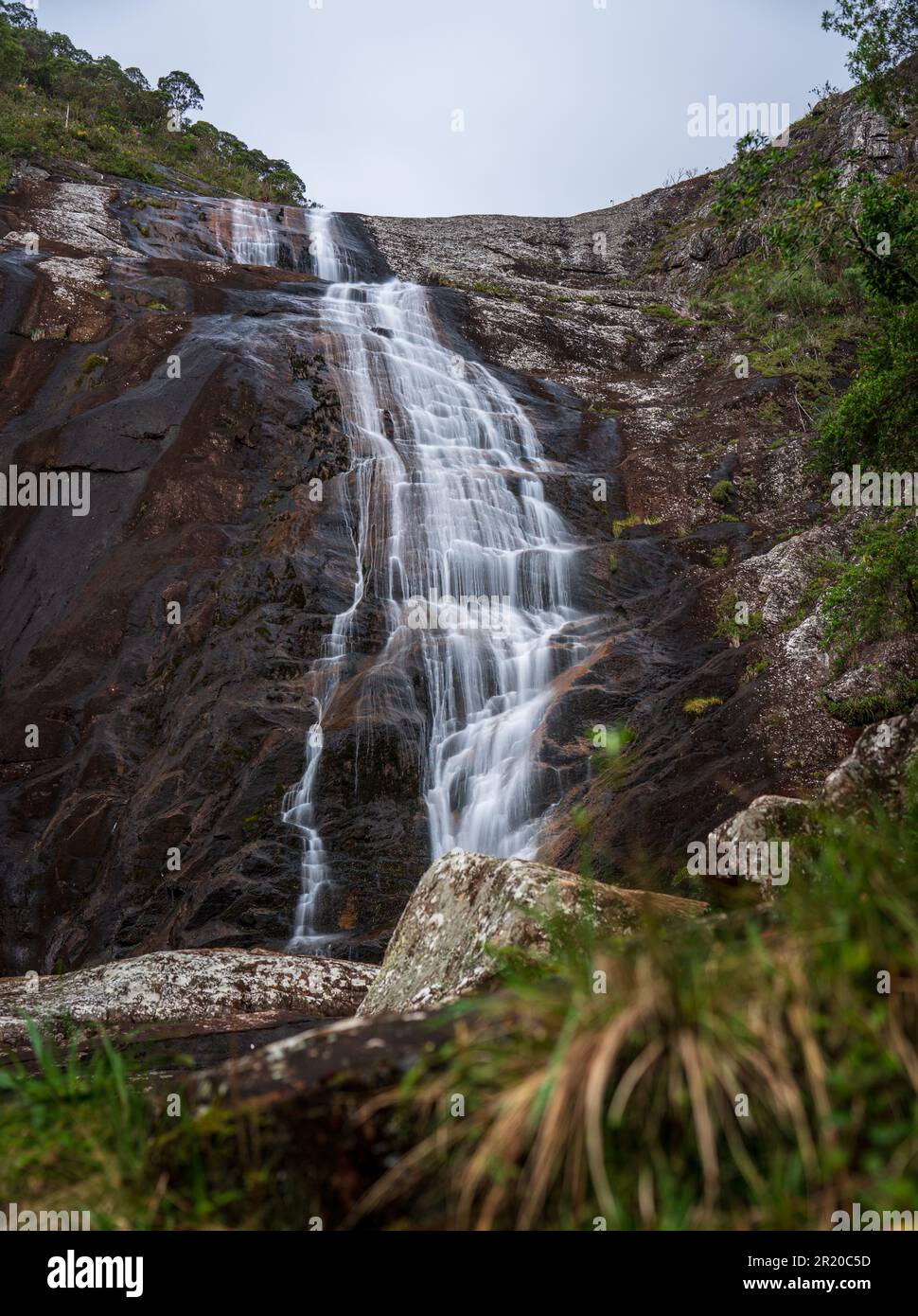 Majestic Waterfall in the Heart of the Jungle with Smooth Flowing Water ...