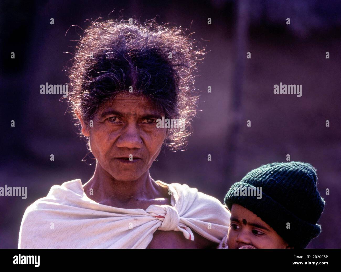 Jenu Kurumba tribal woman with her baby at Nagarahole, Karnataka, South ...