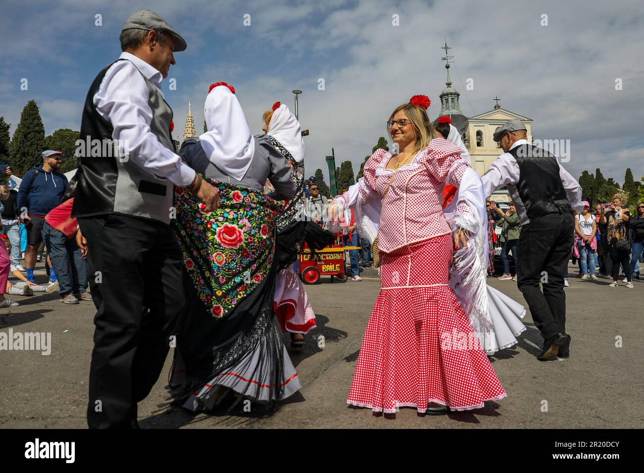 A group of people in typical Madrid costumes dance a chotis during the ...