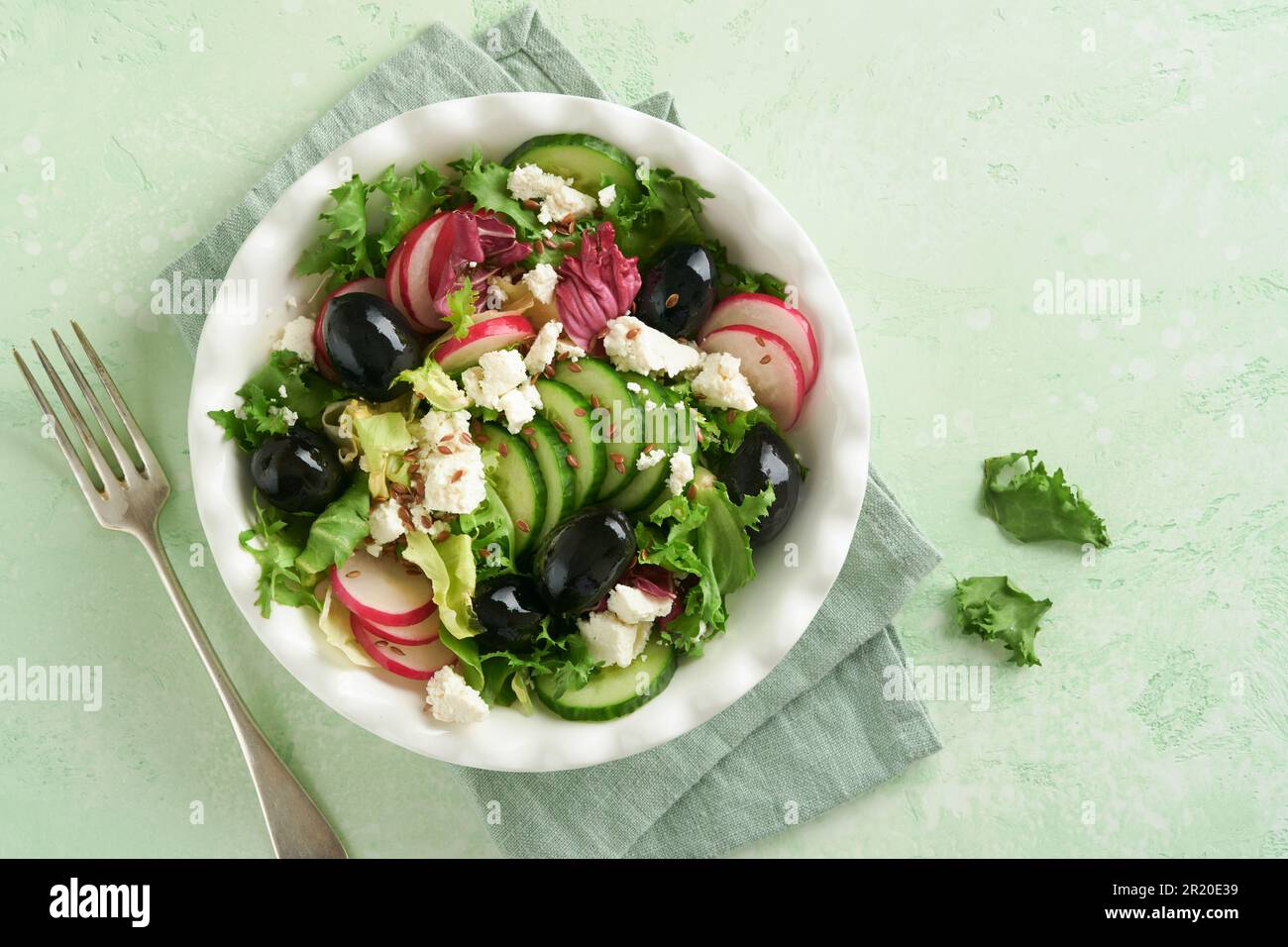 Lettuce salad, cucumber, radish salad with cottage cheese and flax ...