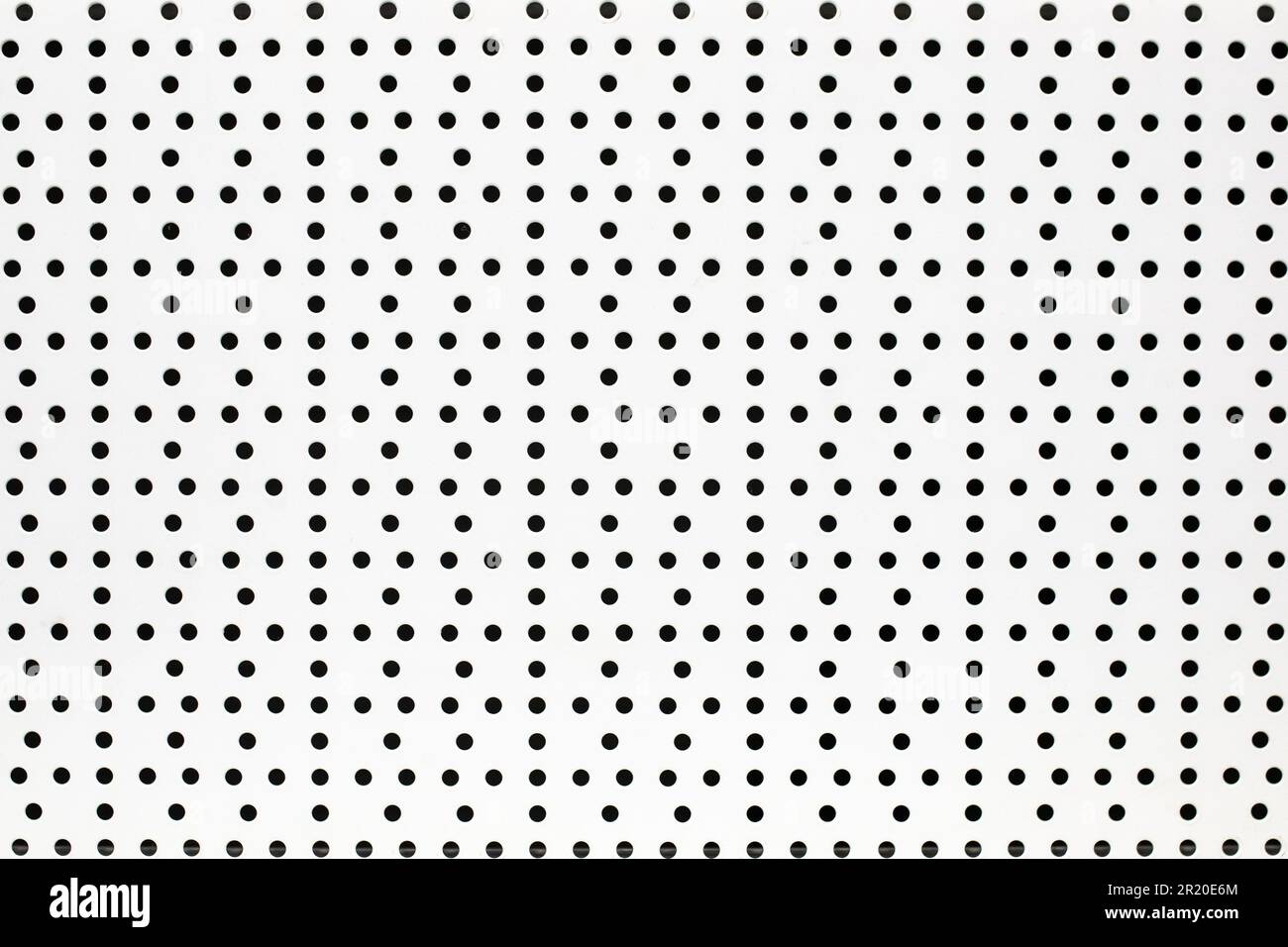 Background of white perforated white painted metal sheet Stock Photo ...