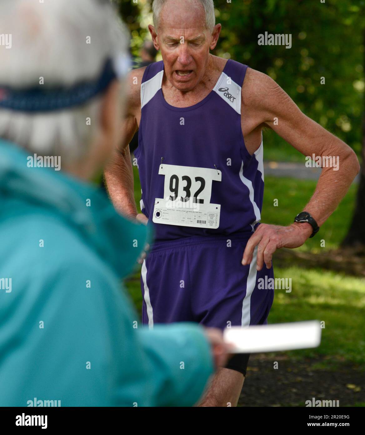 Participants cross the finish line after completing a 5K race in ...