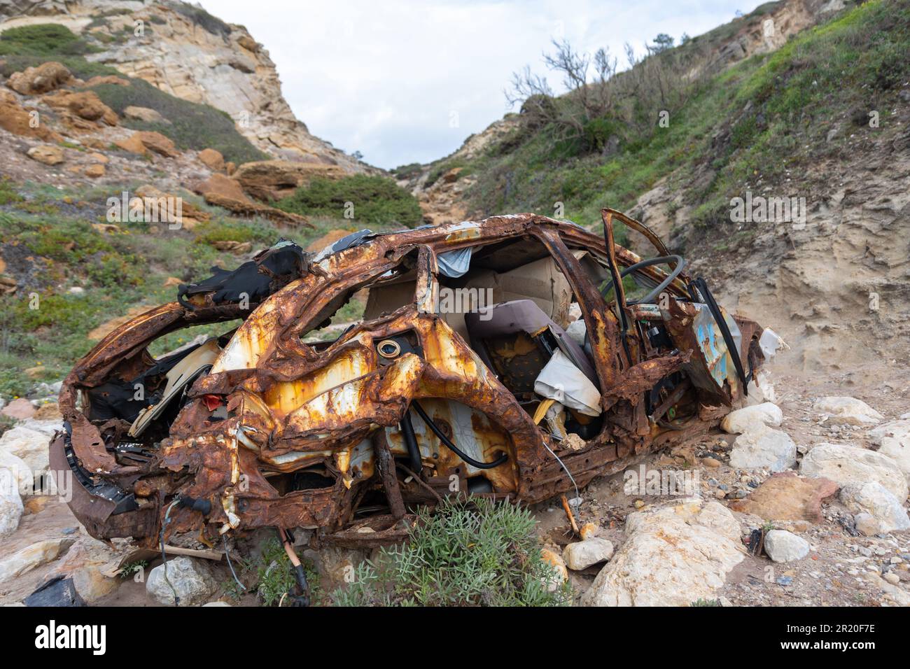 A rusty wrecked car on the beach Stock Photo - Alamy