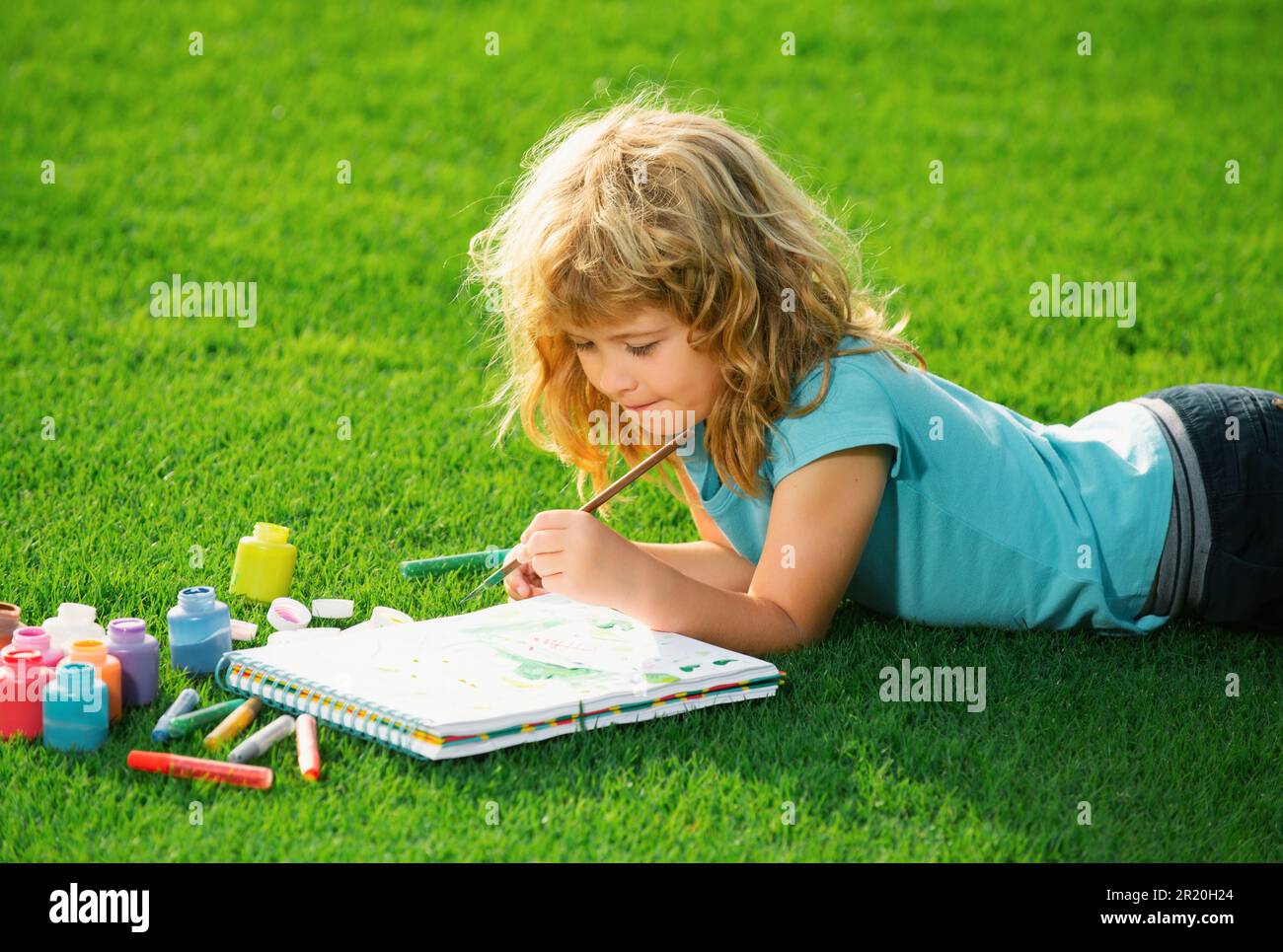 Child painting drawing art. Portrait of smiling happy kid enjoying art ...