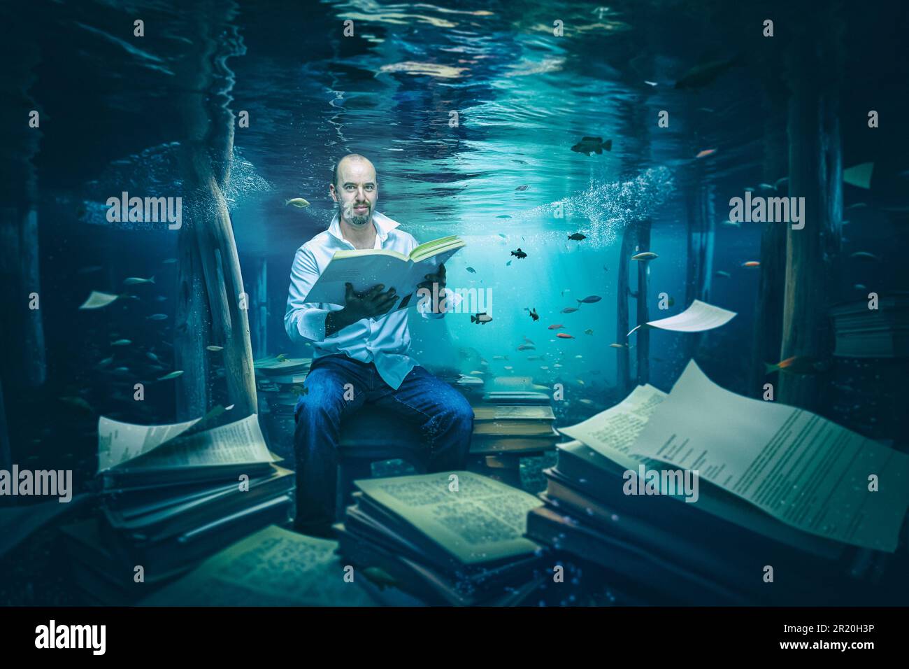 man reads a book underwater background Stock Photo - Alamy