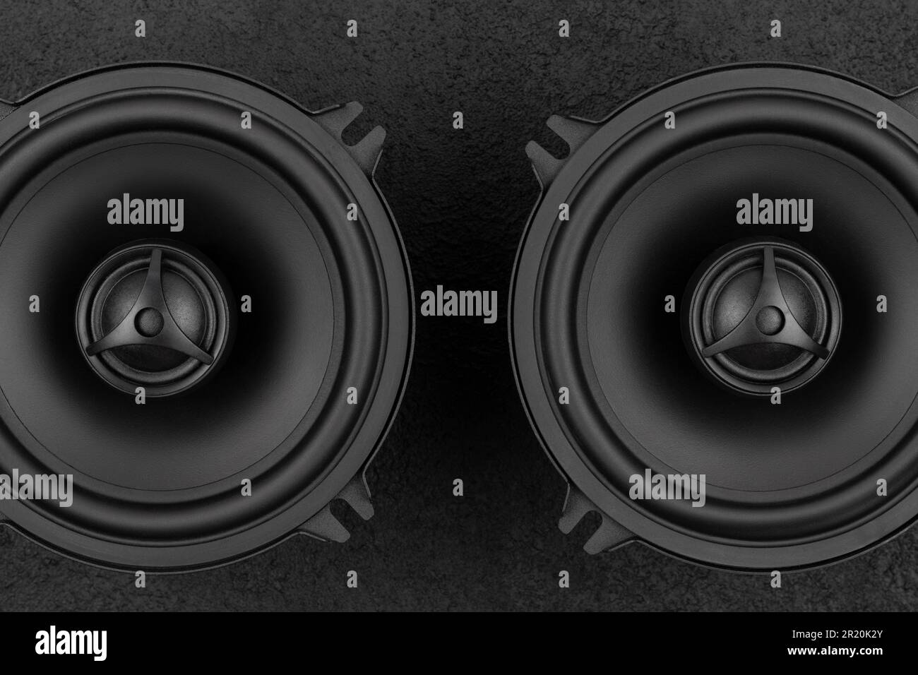 Stylish car audio acoustic round speakers on dark black background ...