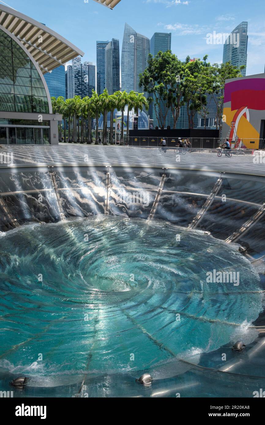 A whirlpool water feature at Marina Bay looking towards the financial ...